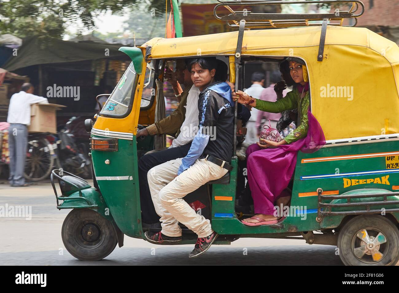Yellow auto rickshaw with passengers hi-res stock photography and ...