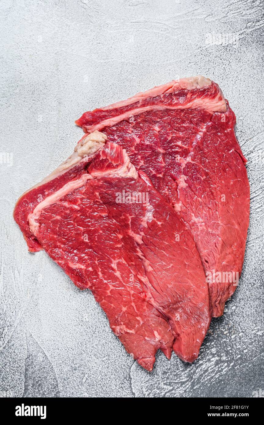 Raw fresh veal meat chop steak. White background. Top view Stock Photo ...