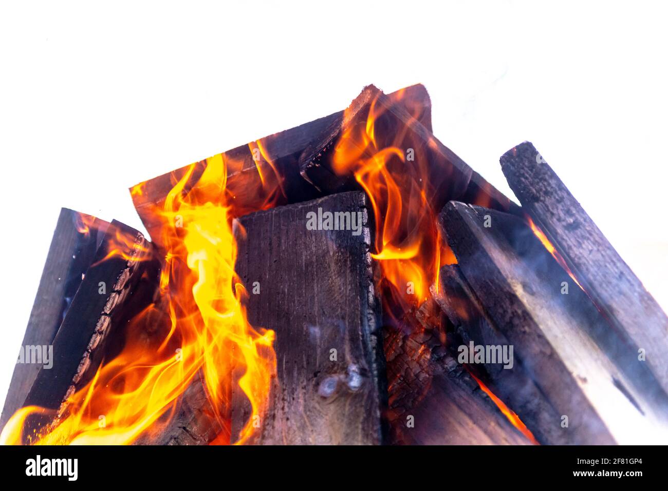 A large fire made of planks. Firewood in a bright flame. Bonfire on a ...