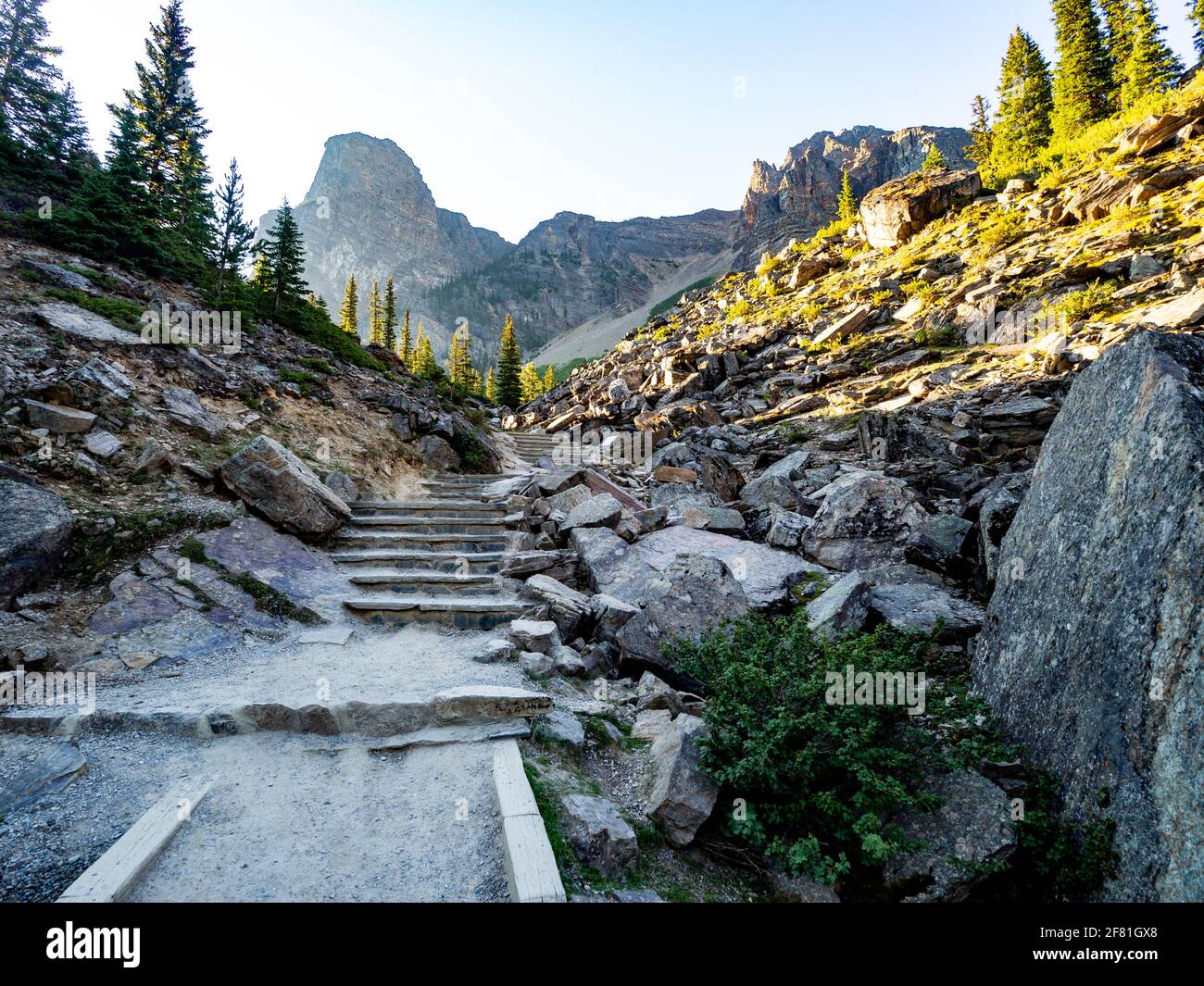 Stone stairs in the mountains looking up with light on a sunrise Stock ...