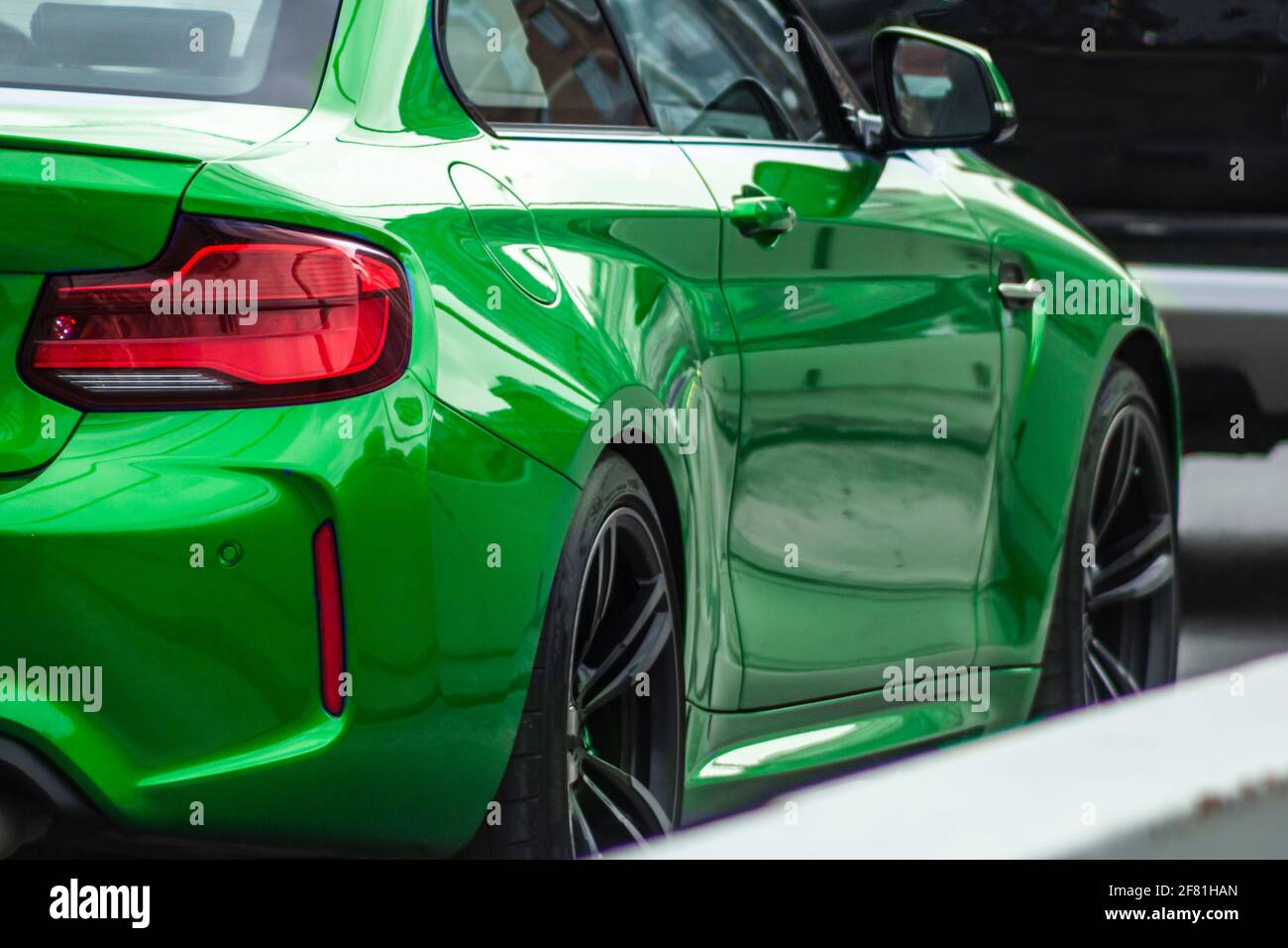 green sports car on the street of the city details stop lights.cleared ...
