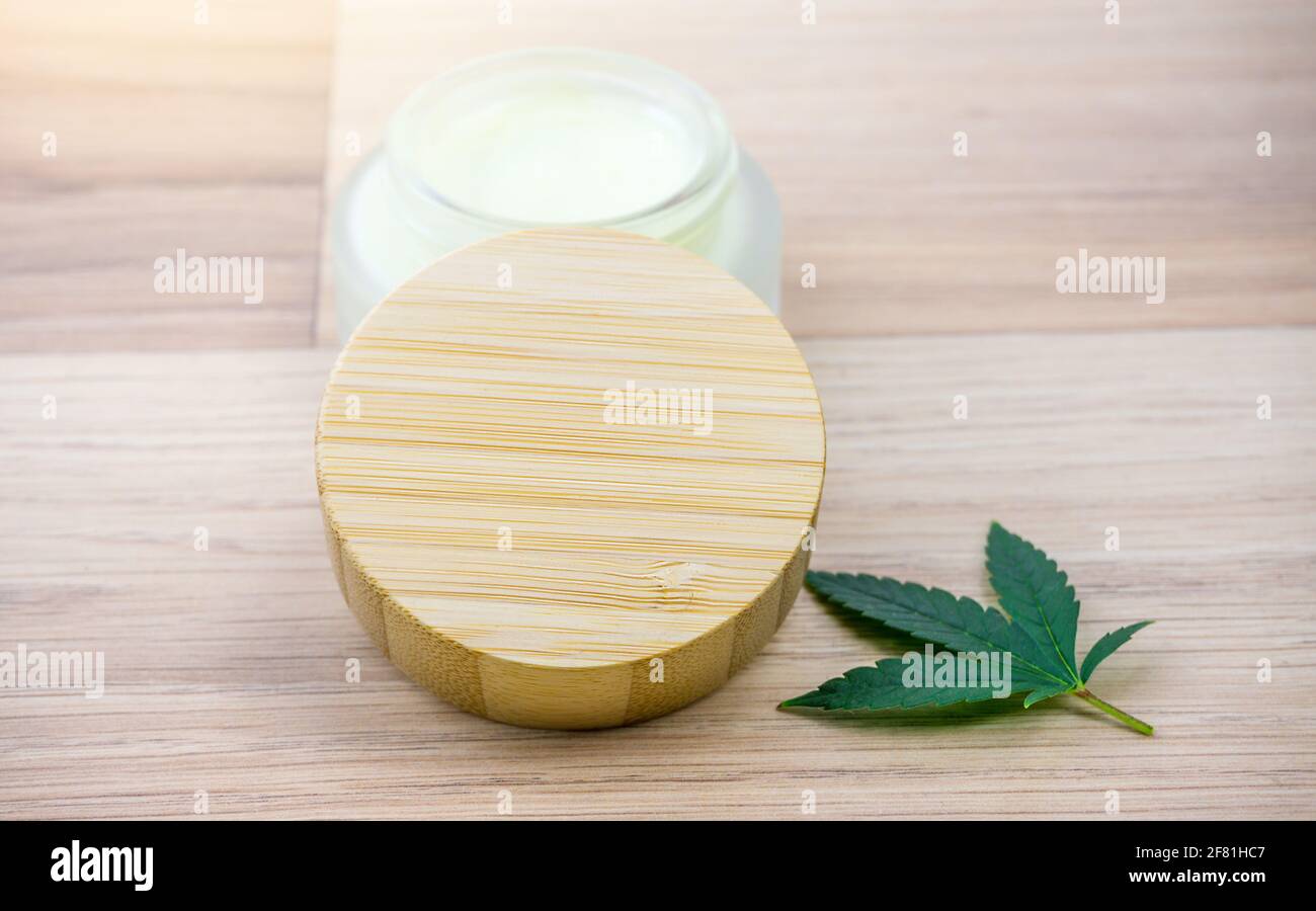 Cannabis CBD lotion in glass container with Cannabis leaf and copy ...