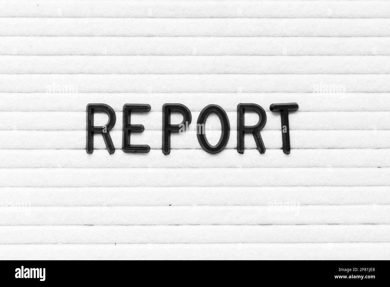 Black color letter in word report on white felt board background Stock ...