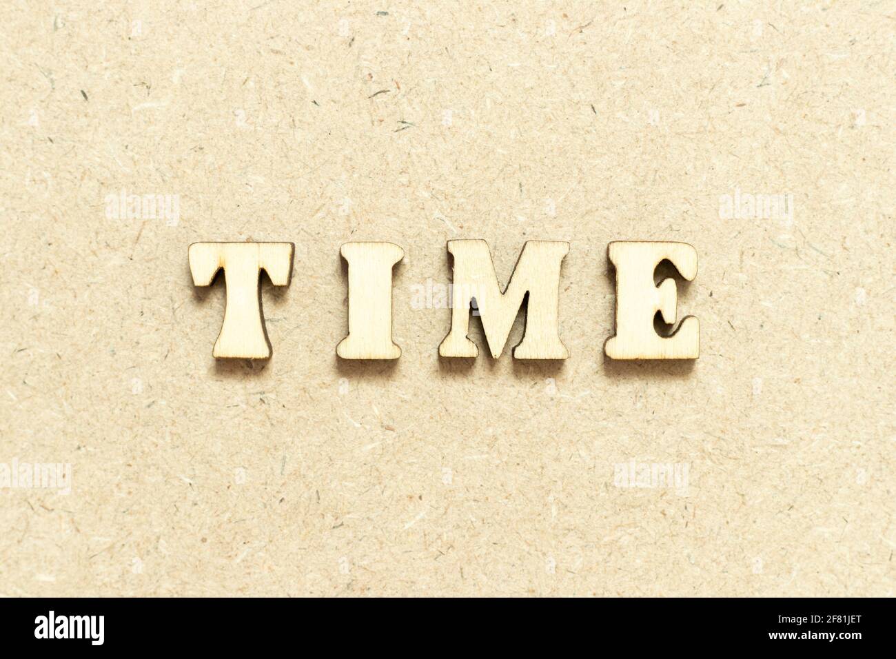 Alphabet letter in word time on wood background Stock Photo - Alamy