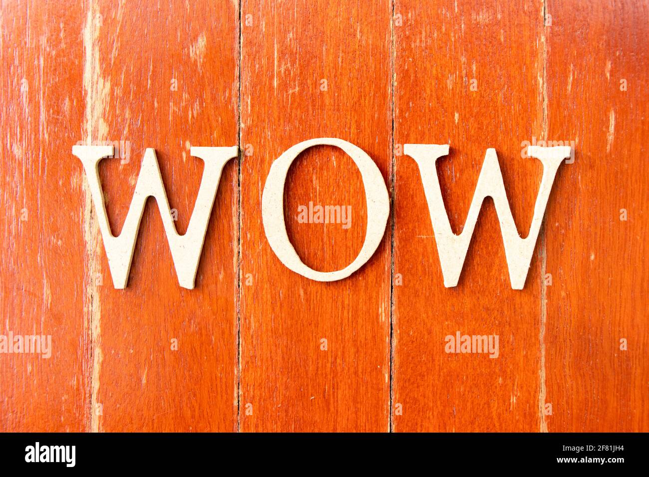 Alphabet letter in word wow on old red color wood plate background ...