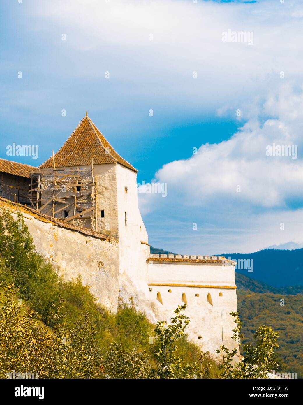 The famous historic Rasnov Citadel under a cloudy sky in Romania Stock ...