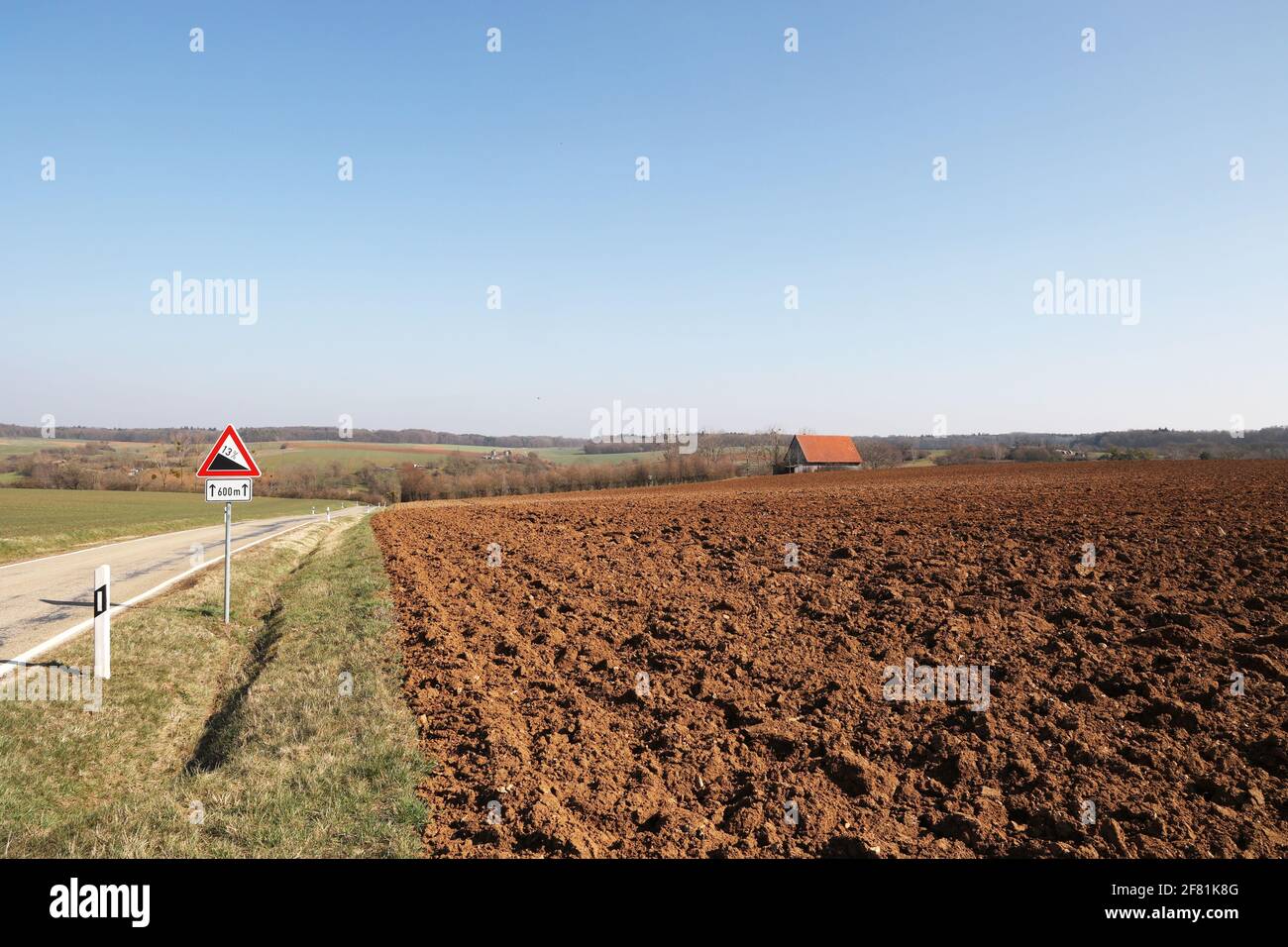 A beautiful spring landscape with arable land and meadows Stock Photo ...