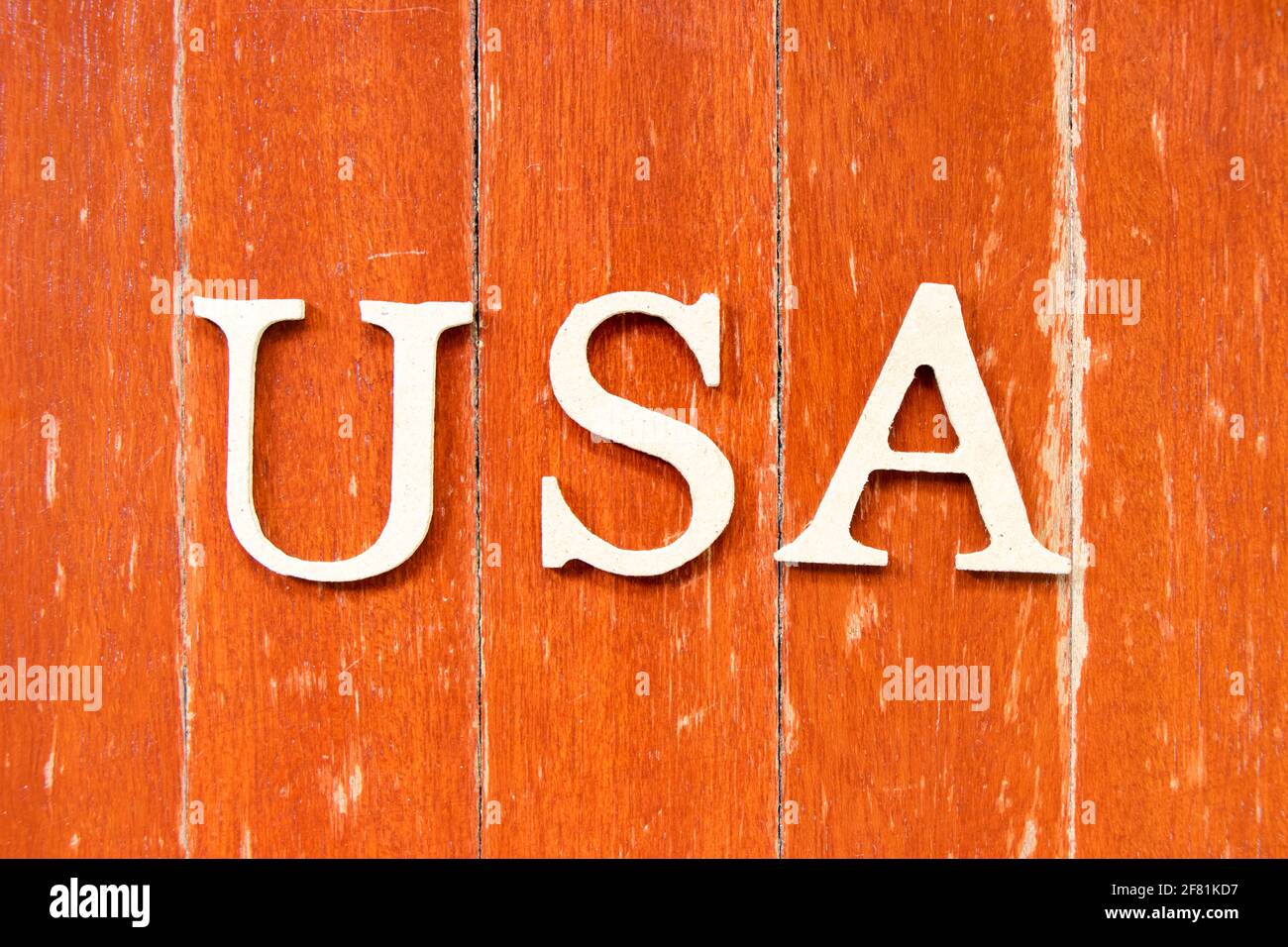 Alphabet letter in word USA (United states of America) on old red color ...