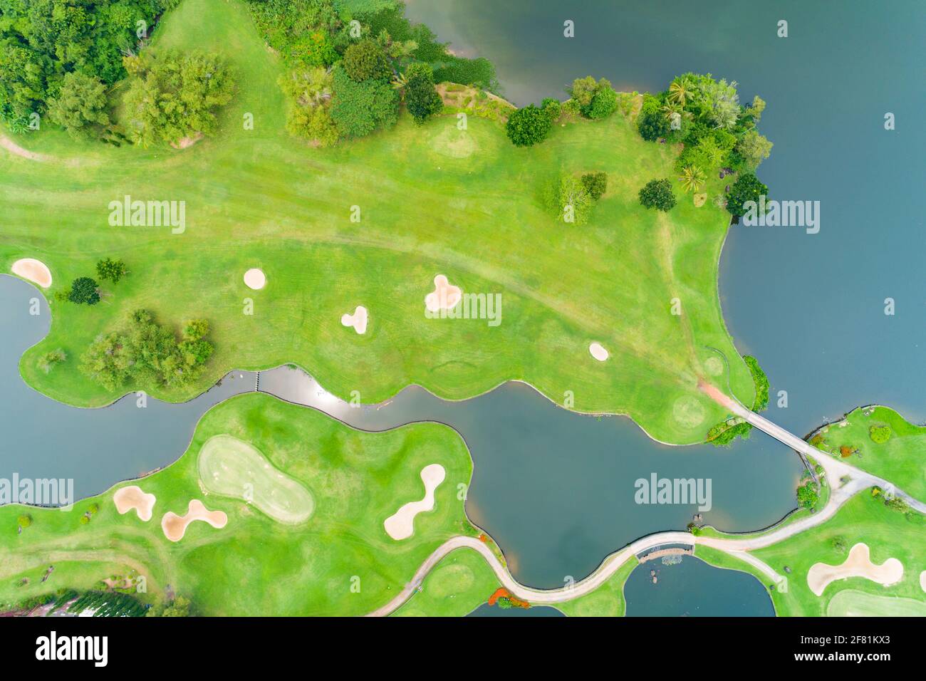 Aerial view drone shot of beautiful green golf field fairway and ...