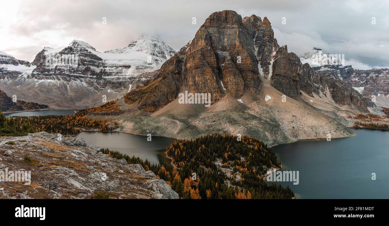 high point of view of a tall mountain peak in fall with a bit of snow ...