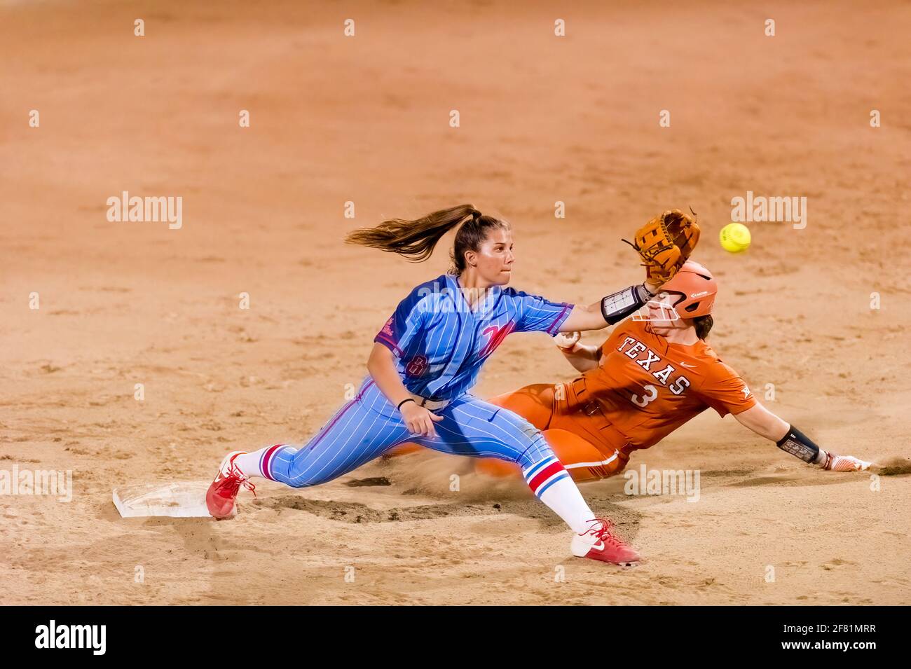 Girl softball player sliding into base hi-res stock photography and ...