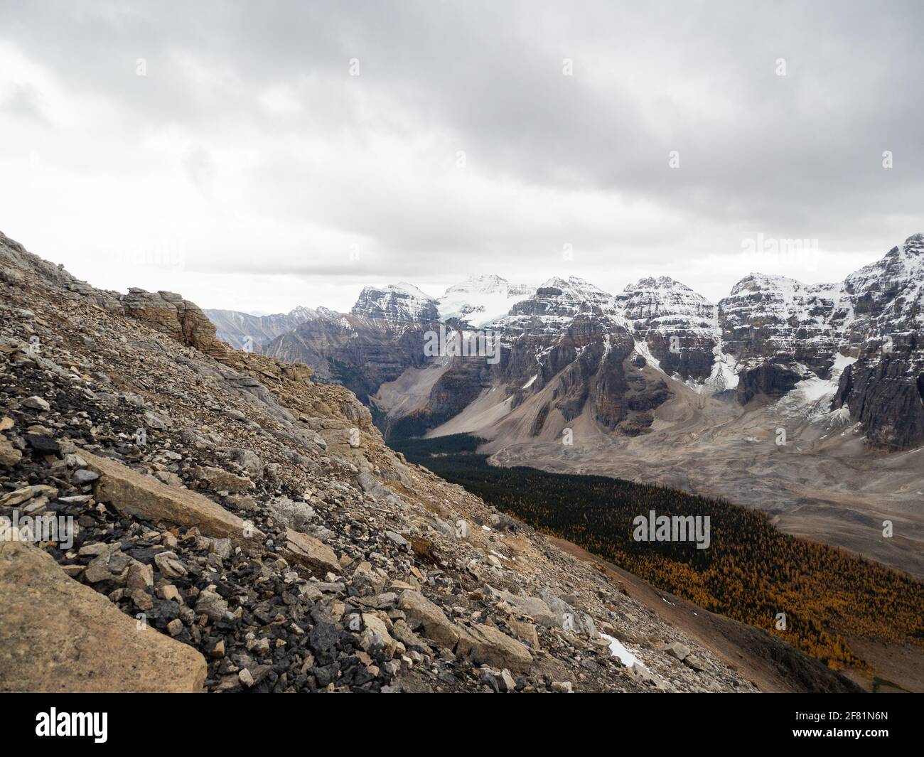snowy summit in the mountain in the season change view downhill Stock ...