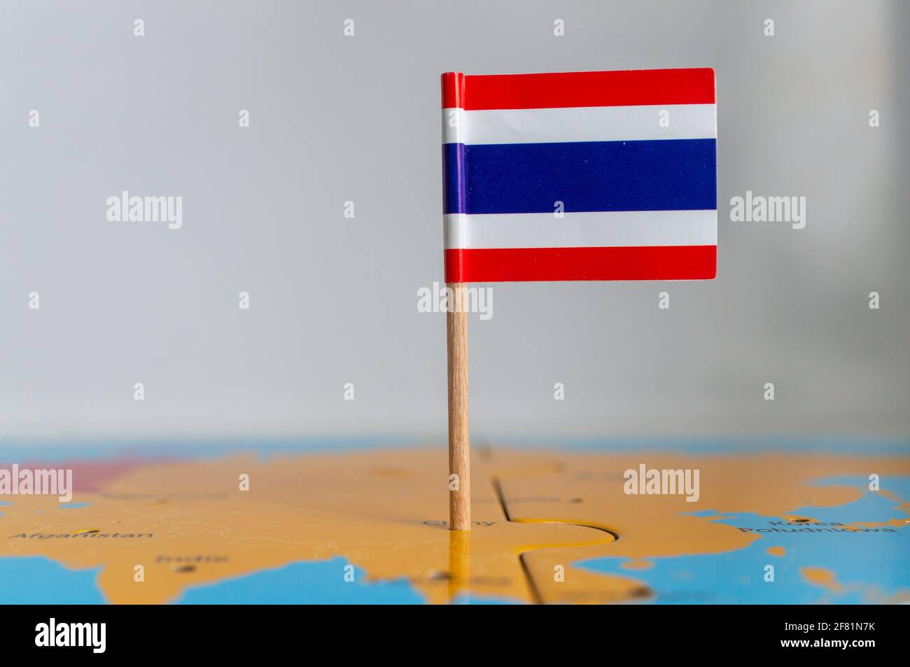 A small flag of Argentina on a wooden stick fixed on the globe Stock ...