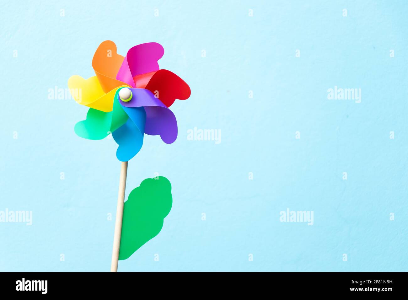 Colorful toy plastic turbine windmill on blue background Stock Photo ...