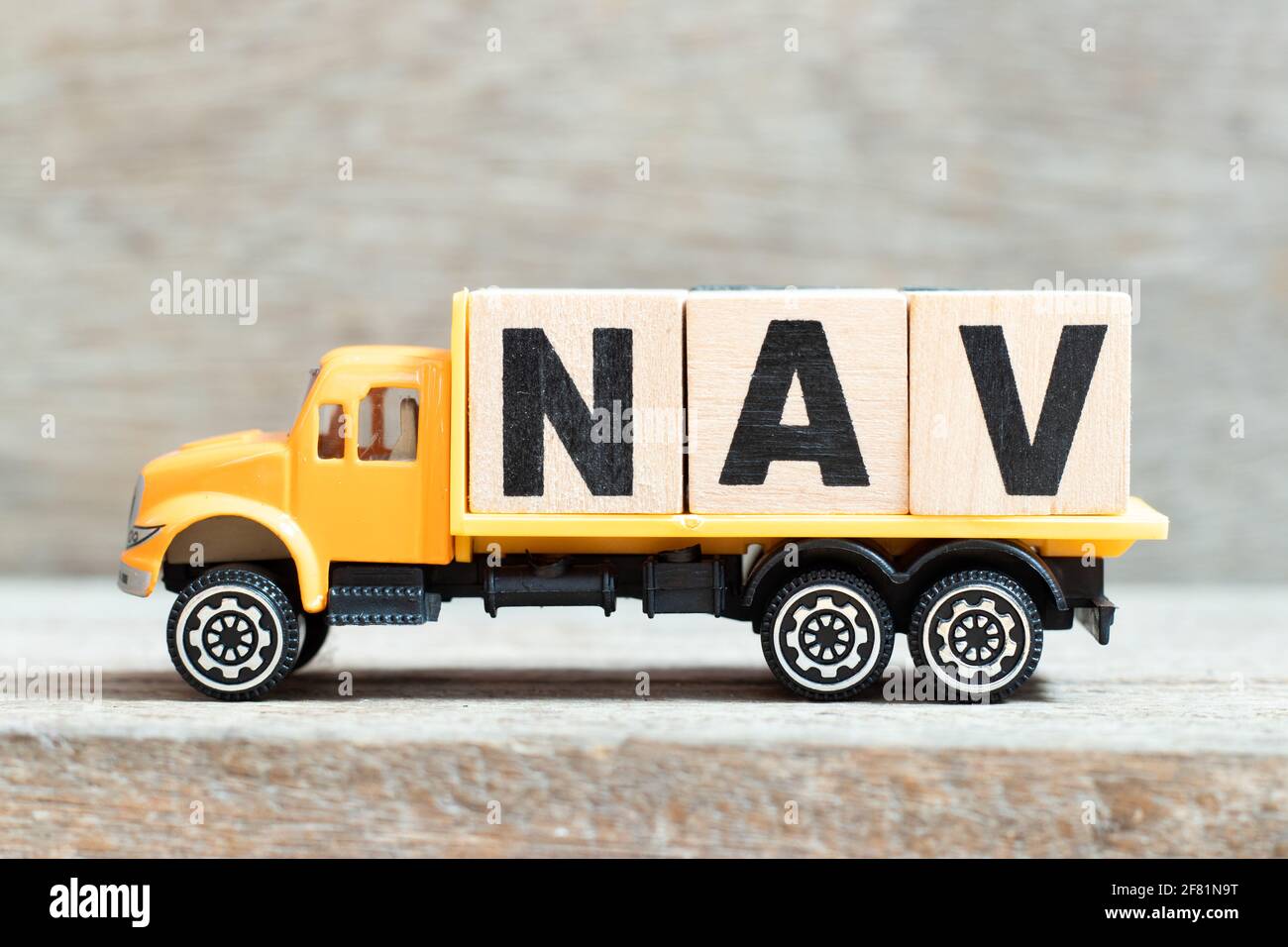 Toy truck hold alphabet letter block in word NAV (Abbreviation of Net ...