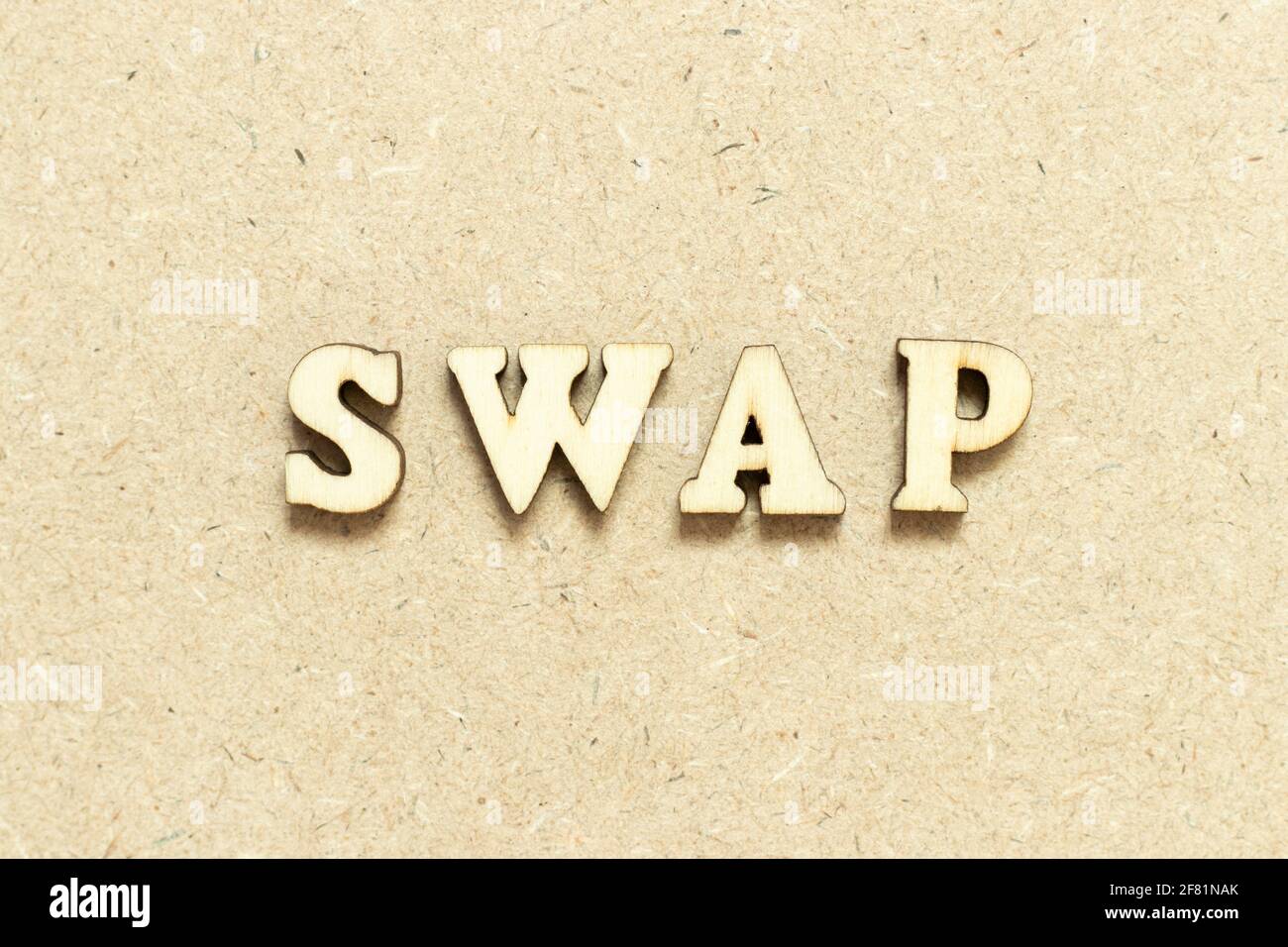 Alphabet letter in word swap on wood background Stock Photo - Alamy