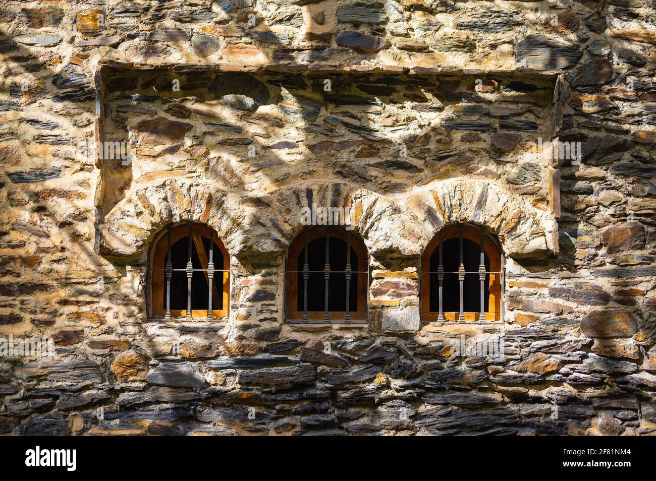 stone textured window arches with tree shadows Stock Photo - Alamy