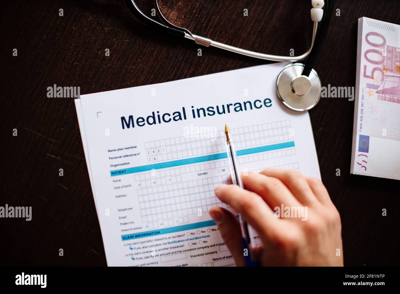 man filling medical insurance policy Stock Photo - Alamy