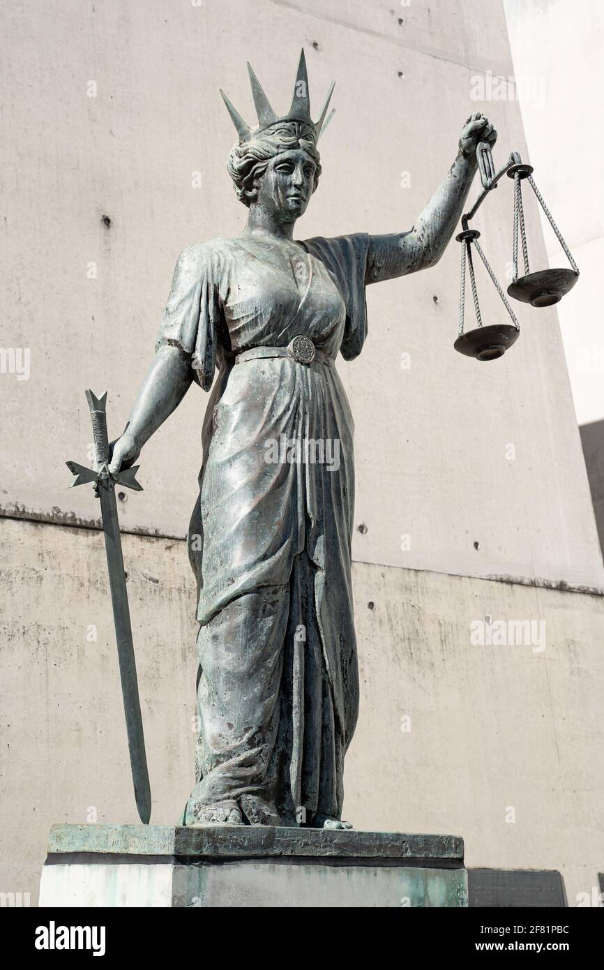 Statue of Lady Justice with the sword in one hand and the scales of ...