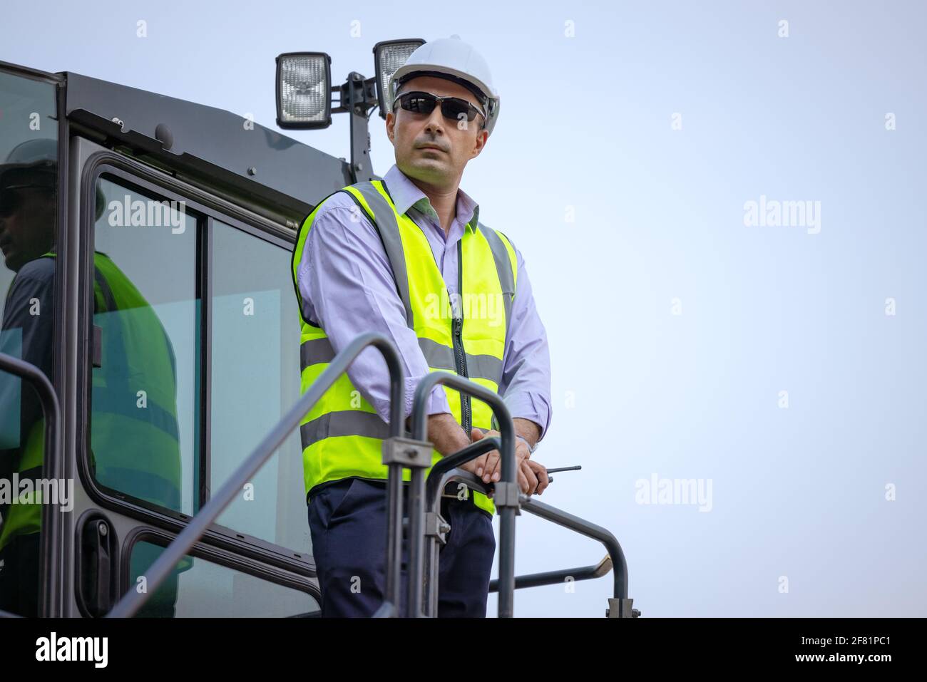 Construction man driver with excavator outdoor site, Industrial Manager ...