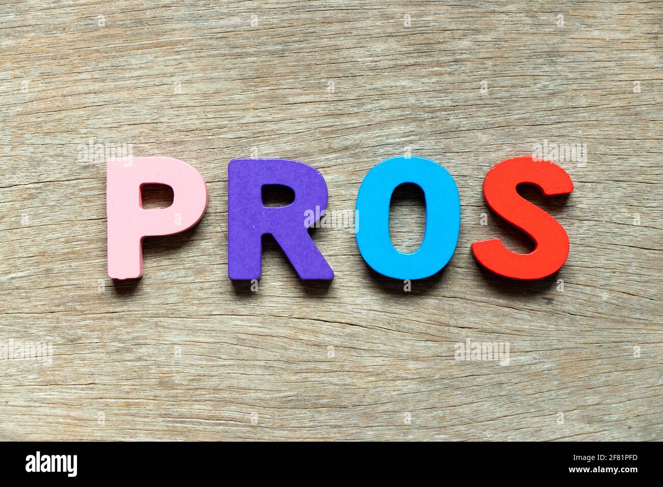 Color alphabet letter in word pros on wood background Stock Photo - Alamy