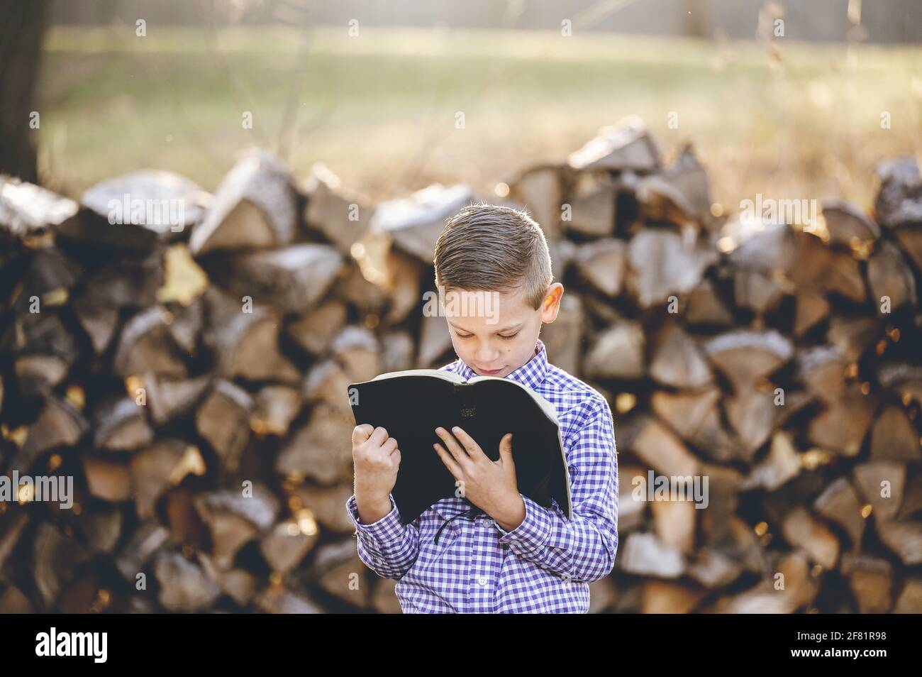 Boy reading bible hi-res stock photography and images - Alamy