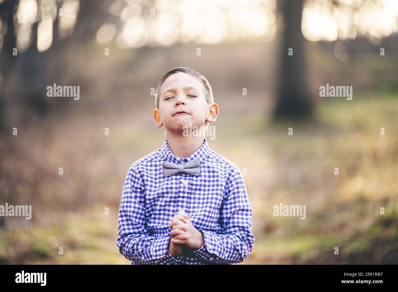A portrait of a little Christian boy praying Stock Photo - Alamy