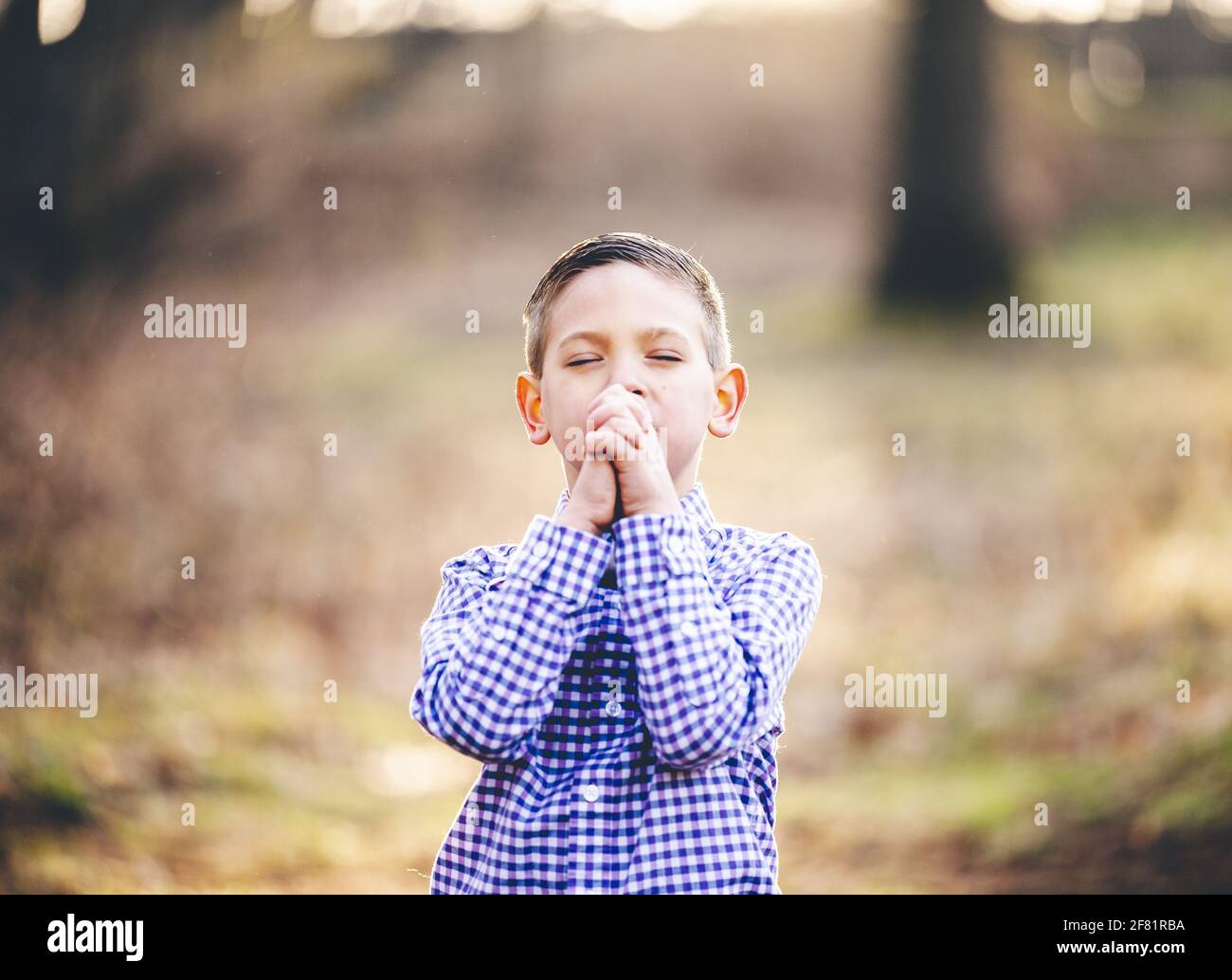 A portrait of a little Christian boy praying Stock Photo - Alamy