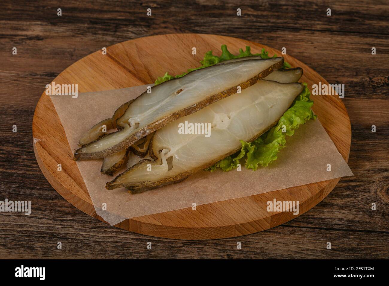 Delicous smoked halibut fish slices snack Stock Photo - Alamy