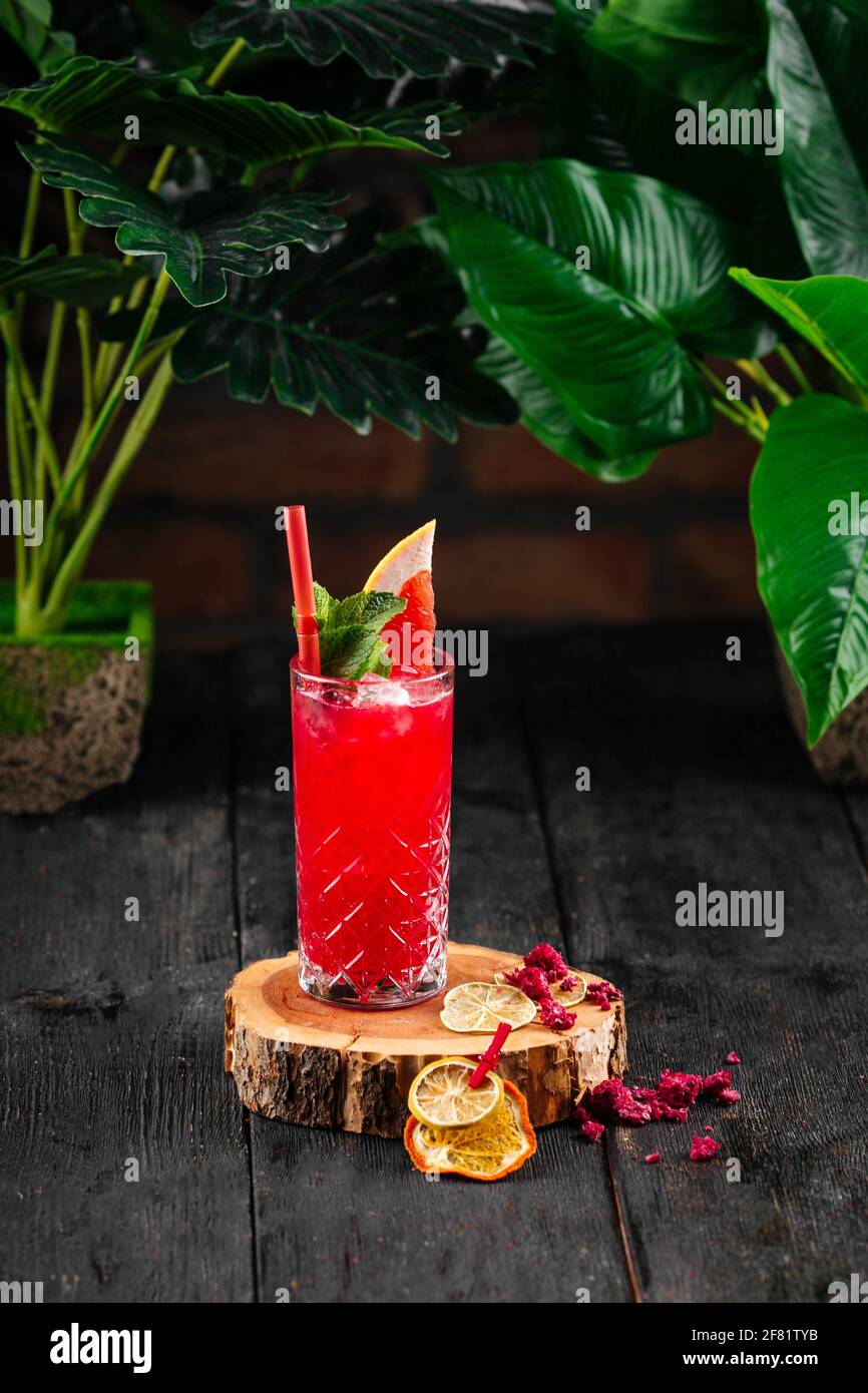 Red alcoholic fruit cocktail in a glass Stock Photo - Alamy