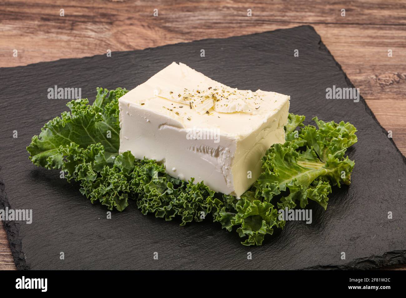 Traditional tasty Greek Feta soft cheese brick Stock Photo - Alamy
