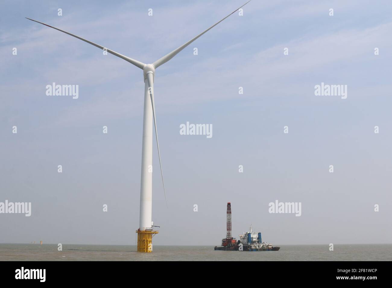 LIANYUNGANG, CHINA - APRIL 11, 2021 - Construction workers perform an ...