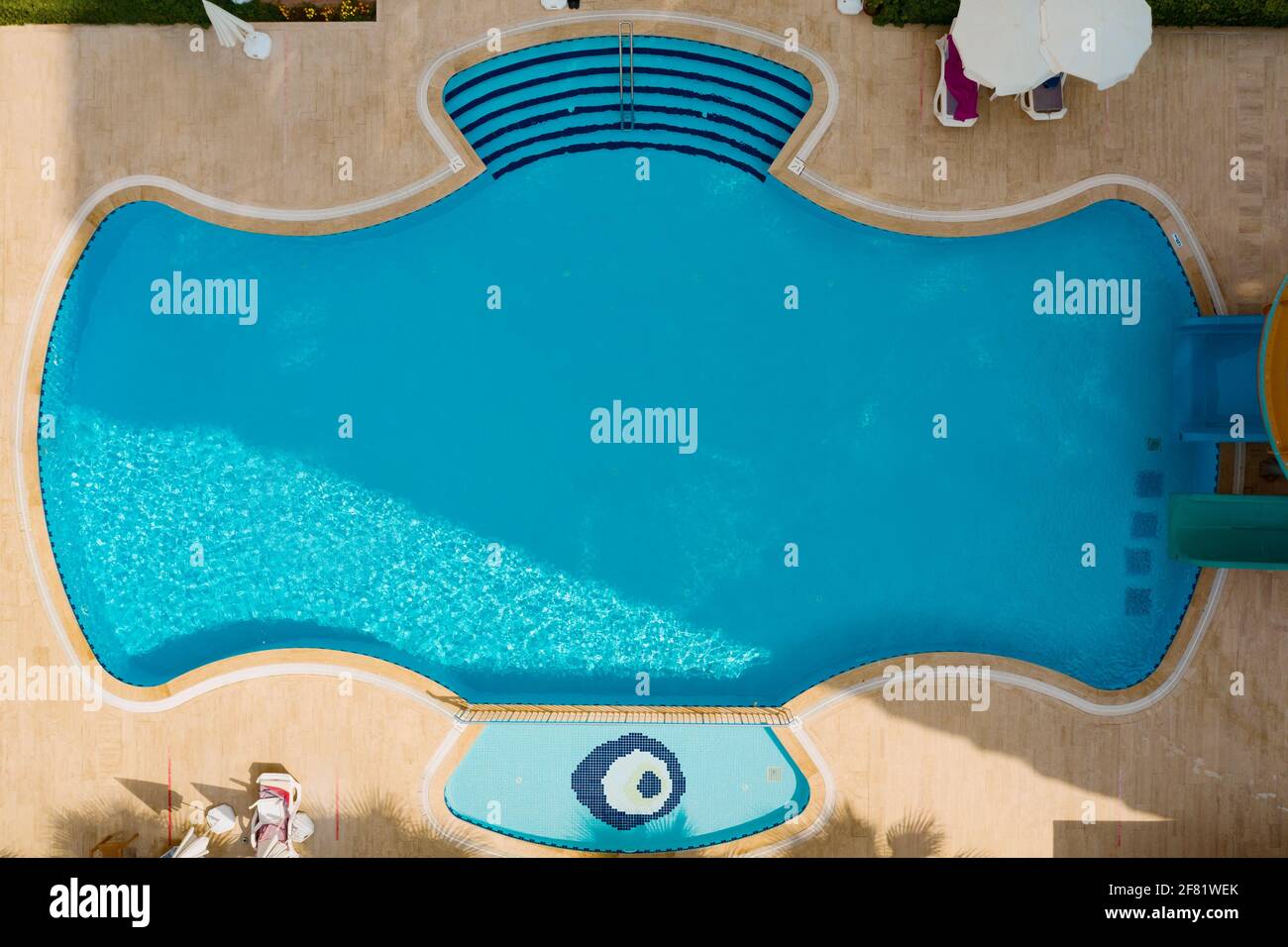 Aerial view of swimming pool outside hotel. Beautiful pool ready to ...