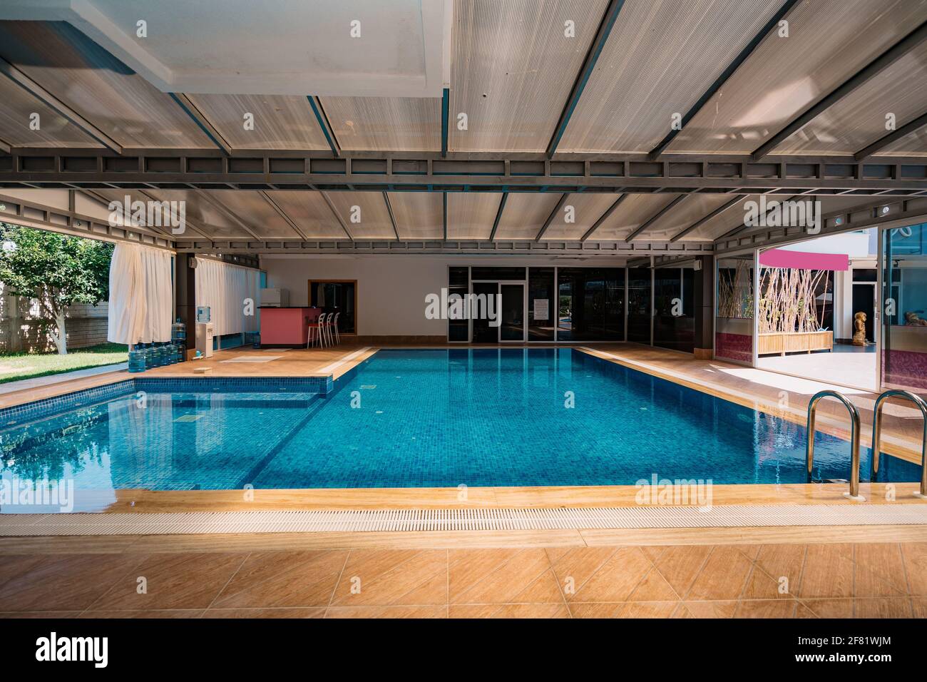 Aerial view of swimming pool inside hotel. Beautiful pool ready to ...