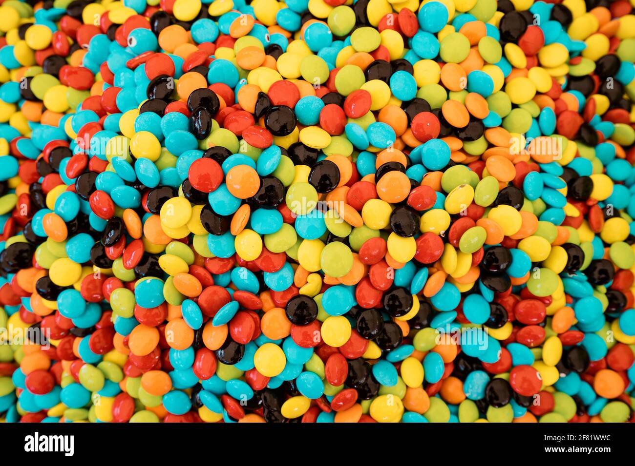 Texture of vibrant multi colored sweet spheric candies. Background made ...