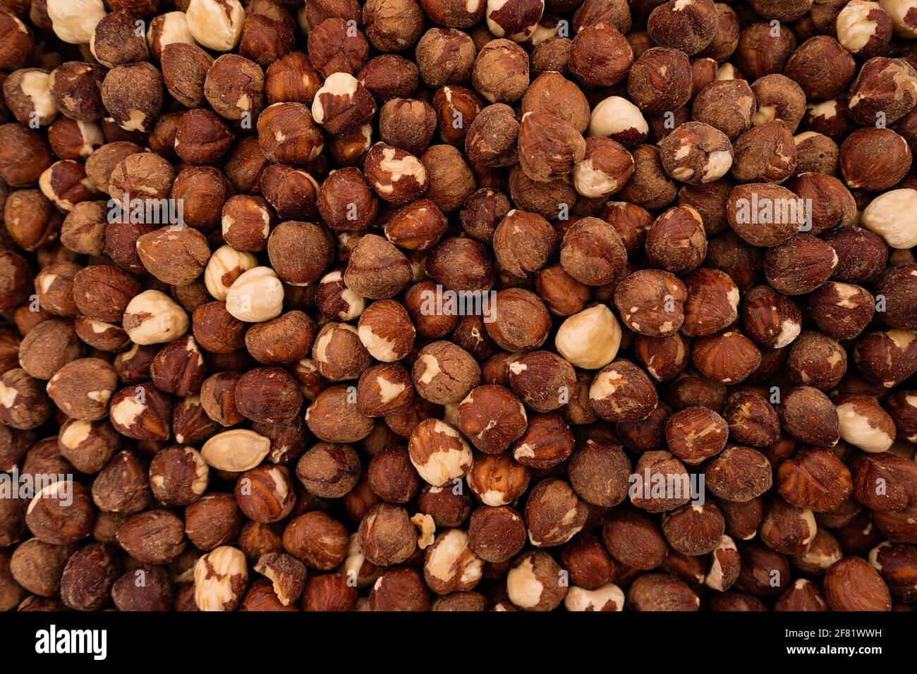 Hazelnuts as an abstract background texture Stock Photo - Alamy