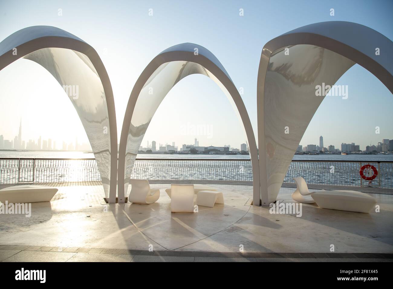 Dubai Creek Harbour arches at sunset with city and Khalifa at the back ...