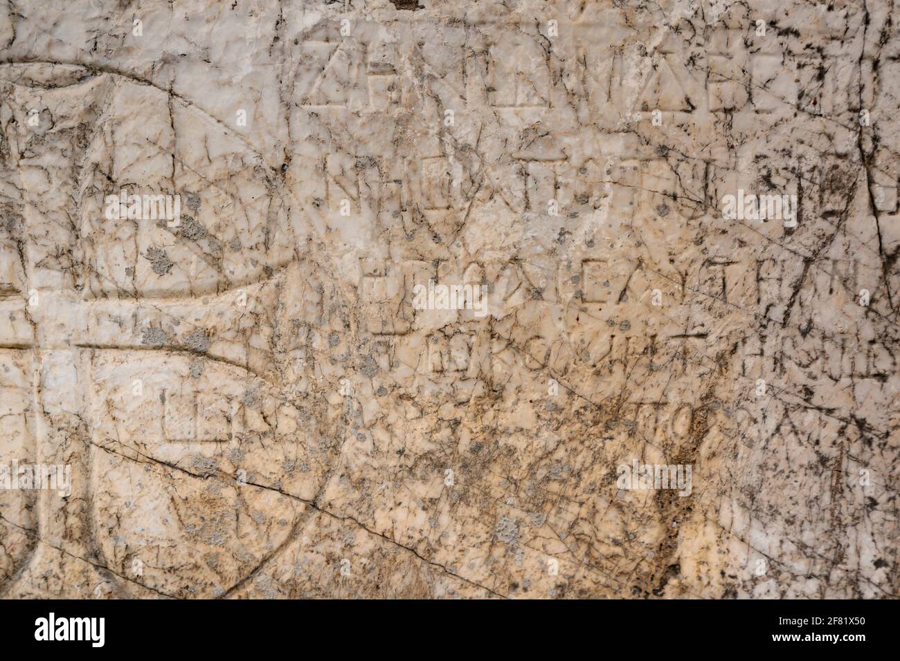 Stone background with antique inscriptions Stock Photo - Alamy