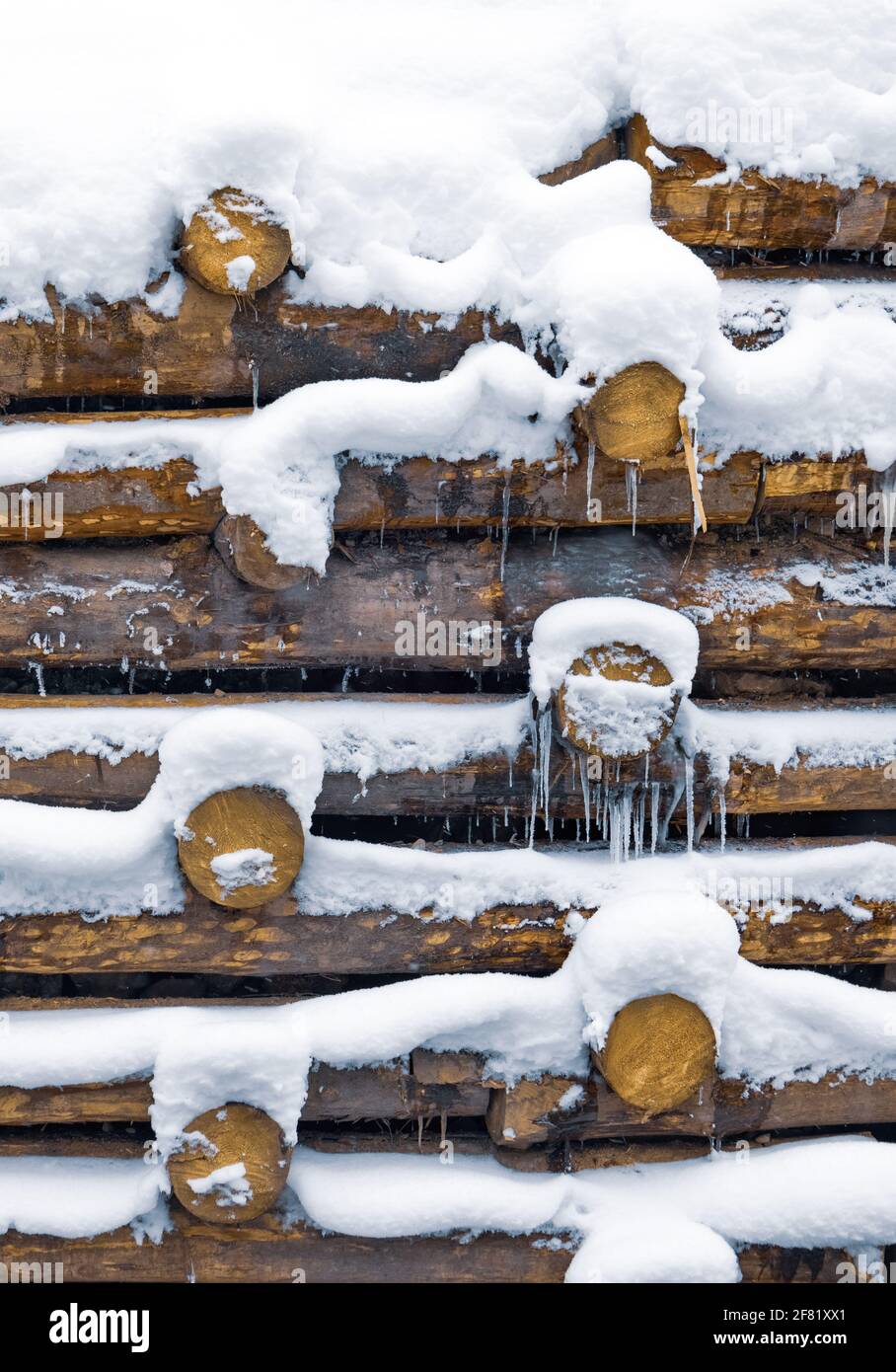 Strengthening of logs, wooden wall under snow in winter Stock Photo - Alamy