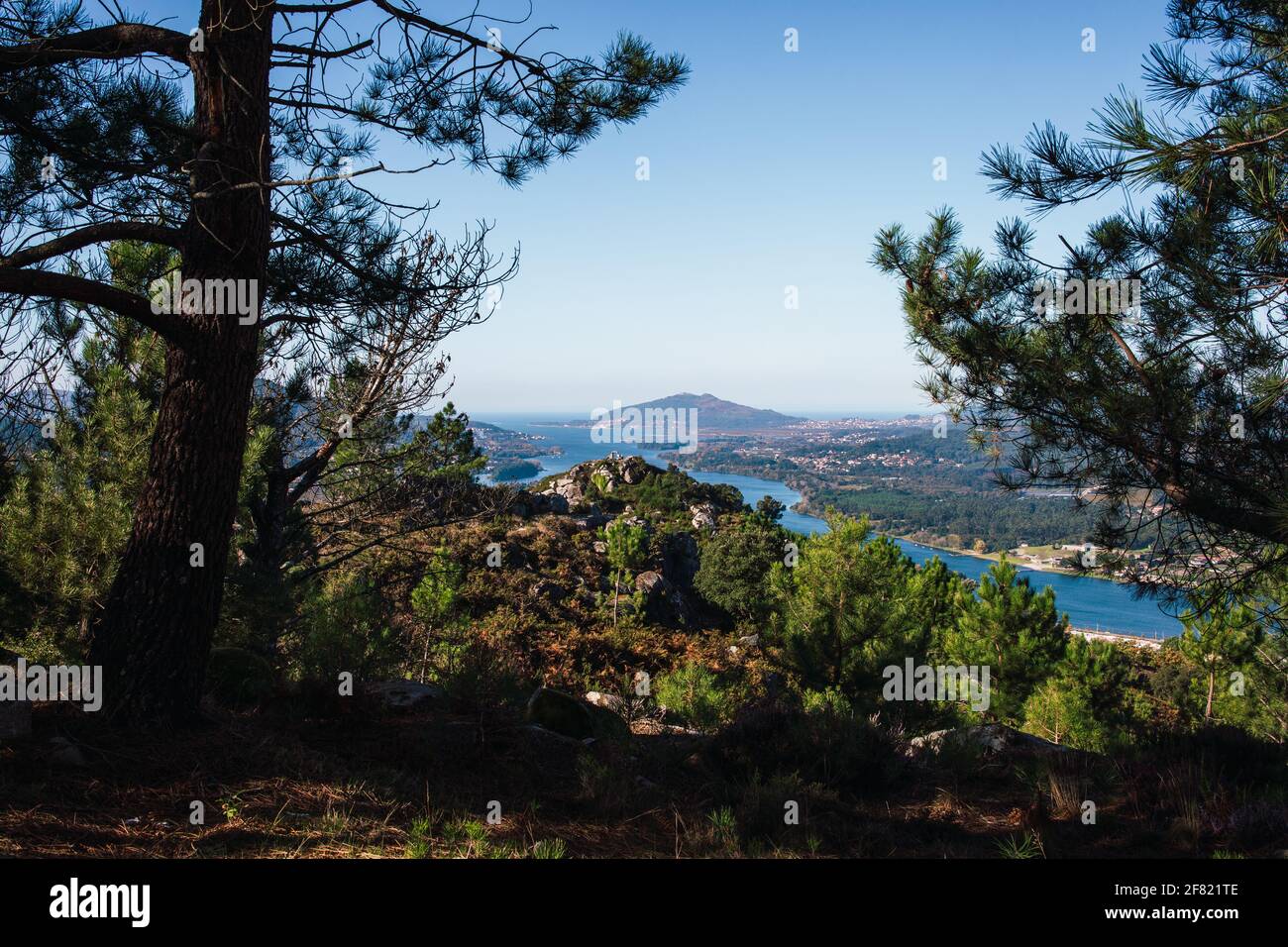 A mesmerizing view of distant islands on a deep blue sea from a hill ...