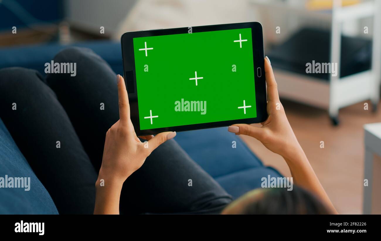 Close up of woman holding in horizontal mode tablet computer with mock ...