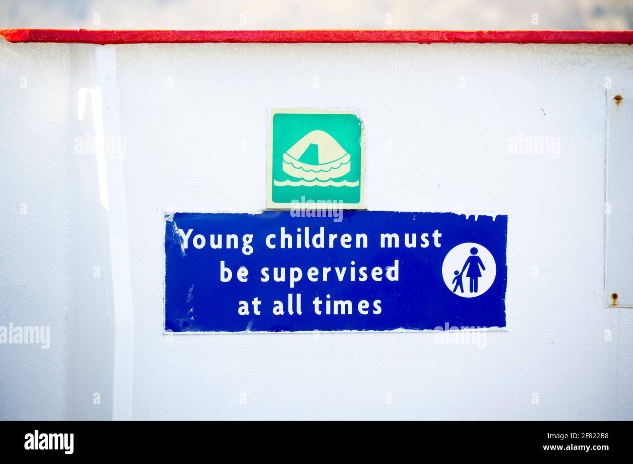 Young children to be supervised safety sign on ship Stock Photo - Alamy