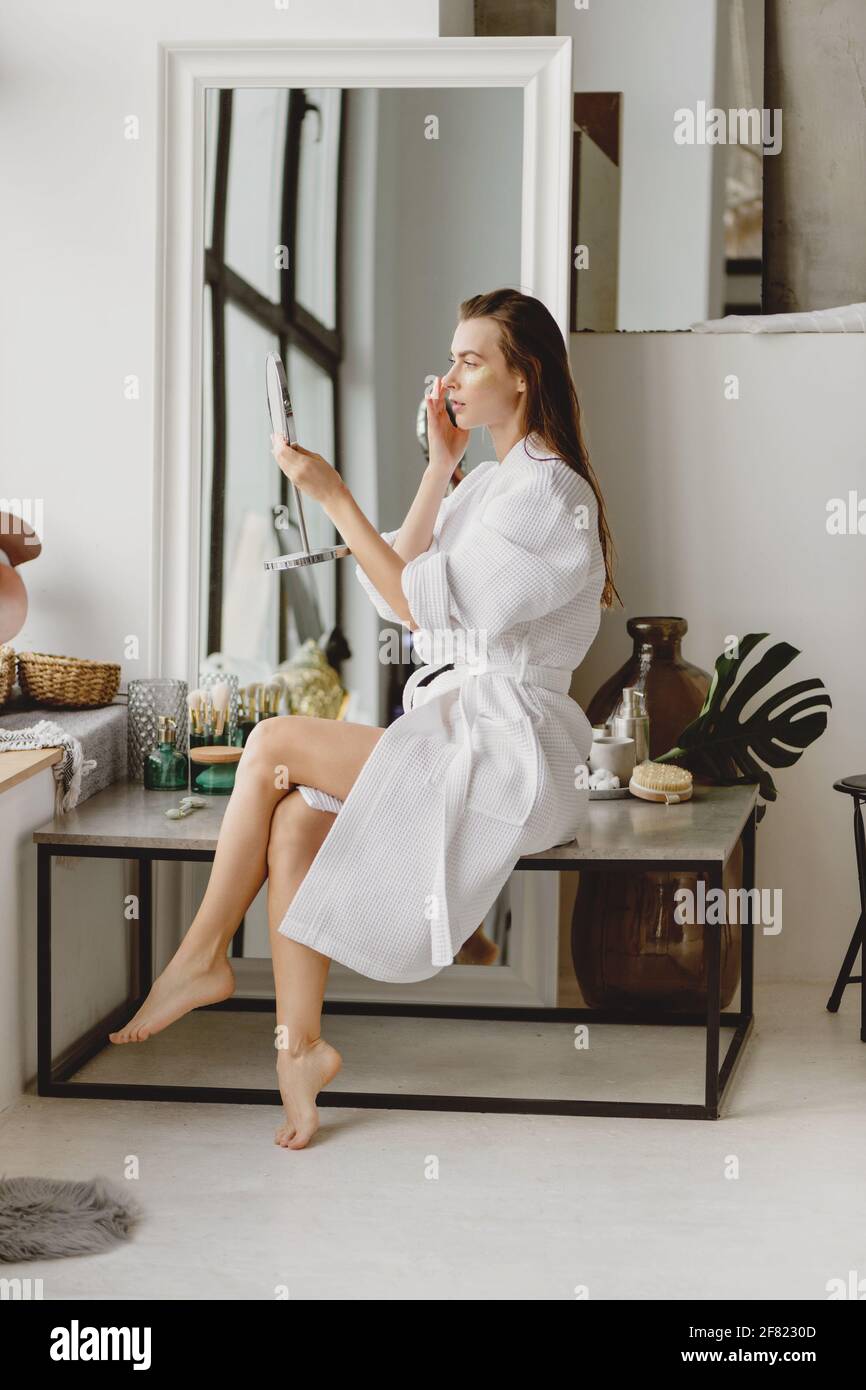 White bathrobe hi-res stock photography and images - Alamy