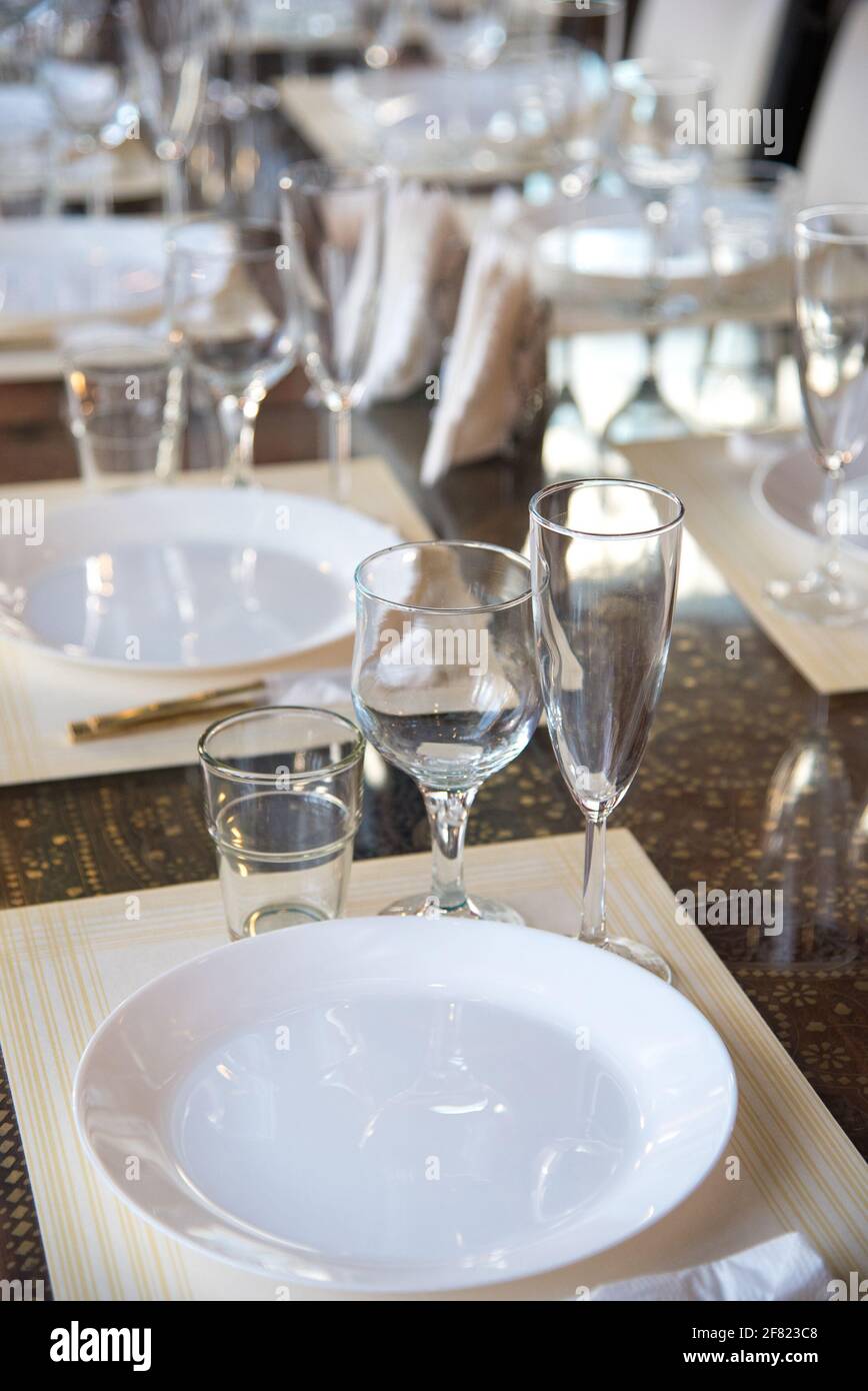 Table setting in the restaurant, including glasses for wine, champagne ...