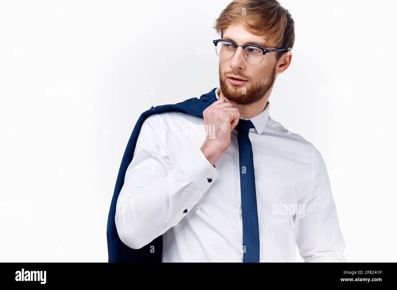 man in a shirt and tie holds a jacket on his shoulder background Stock ...