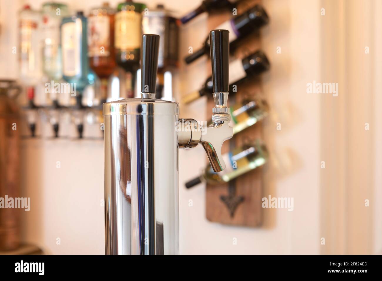 A chrome beer pump in a bar Stock Photo - Alamy
