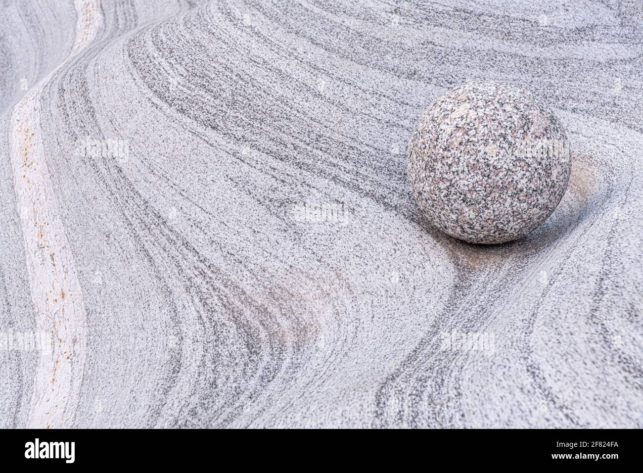 A protected stone ball in natural glacial mill with beautiful textures ...