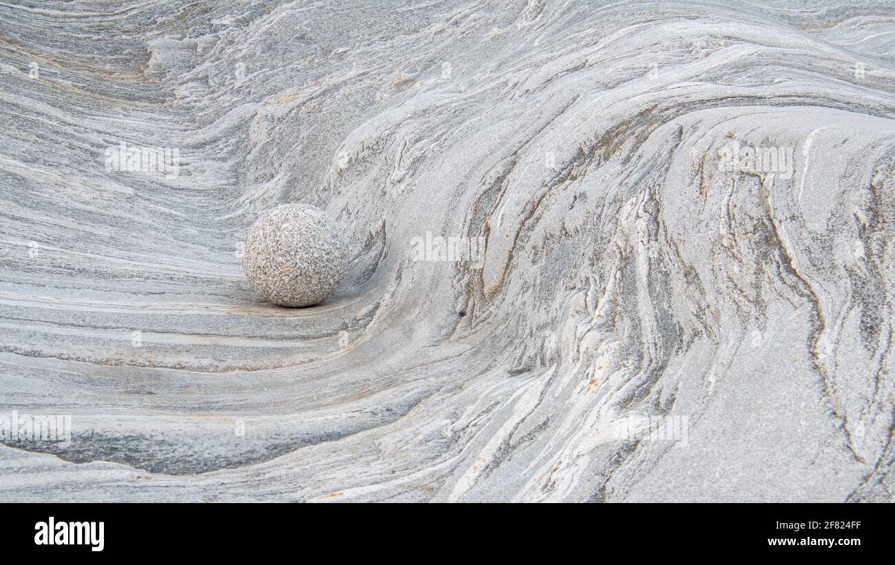 A protected stone ball in natural glacial mill with beautiful textures ...