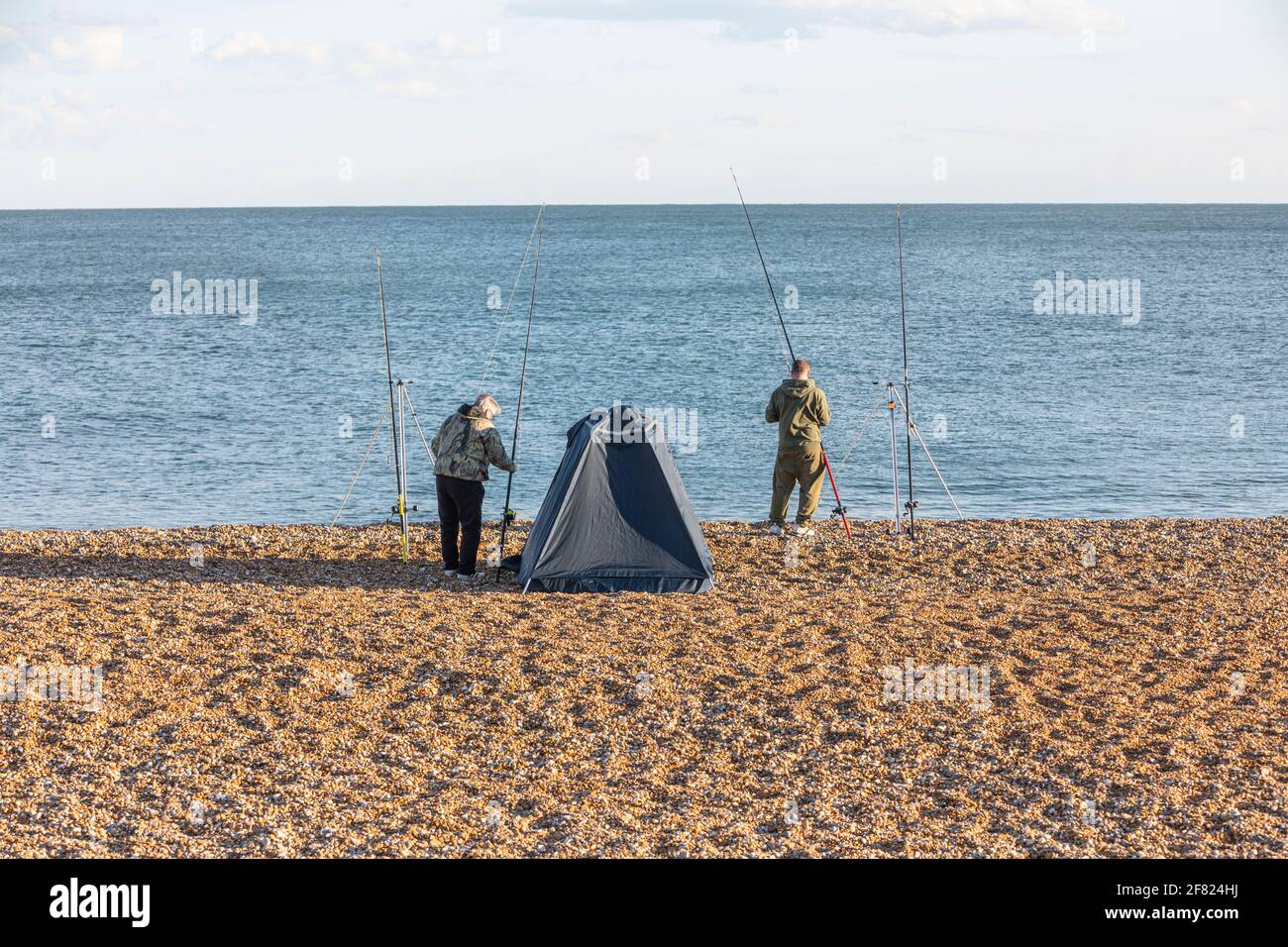 Two men fishing from a beach hi-res stock photography and images - Alamy
