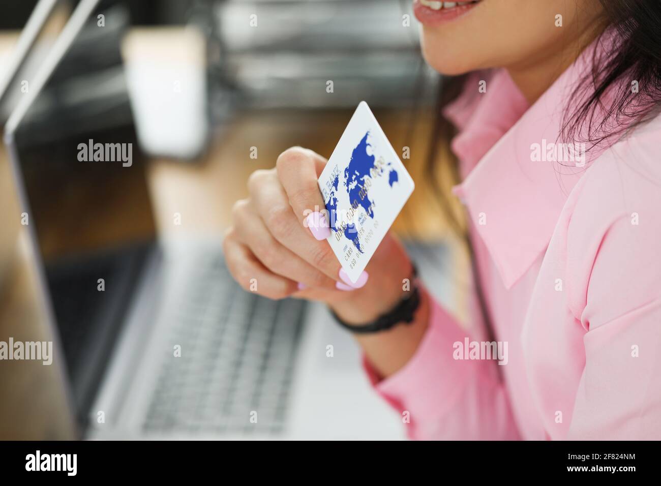 Woman bank card basket hi-res stock photography and images - Alamy